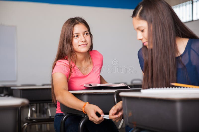 Passing Down Messages in Class Stock Photo - Image of school, female ...
