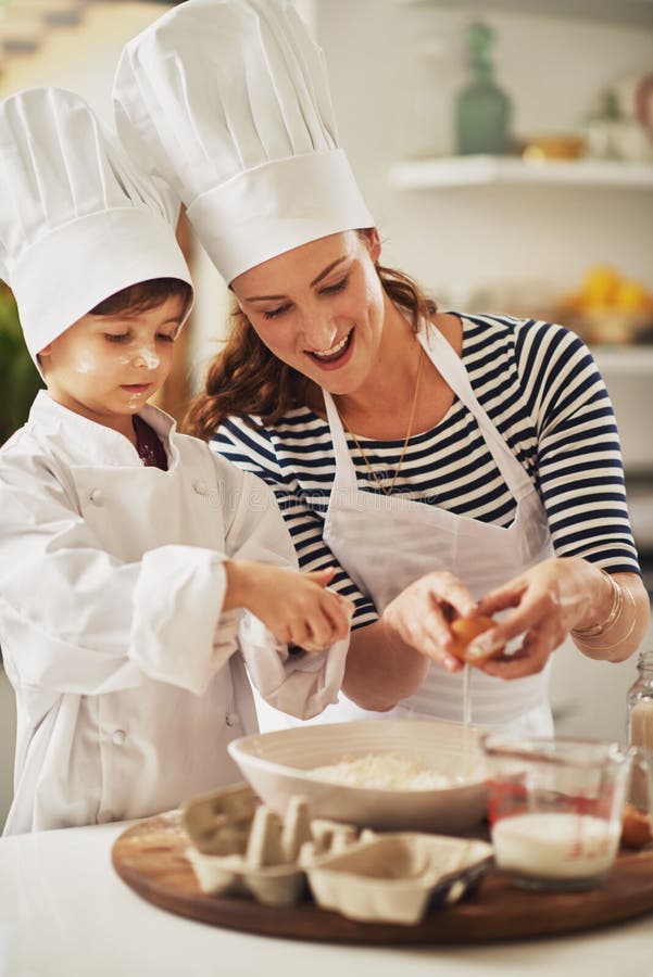 Passing on Her Love of Baking. a Mother and Her Young Son Baking ...