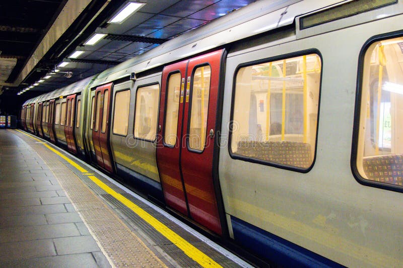 A Passing High Speed Passenger Train Flying Past a Train Station ...