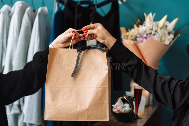 Passing a Paper Bag from Hand To Hand in a Store Stock Photo - Image of ...