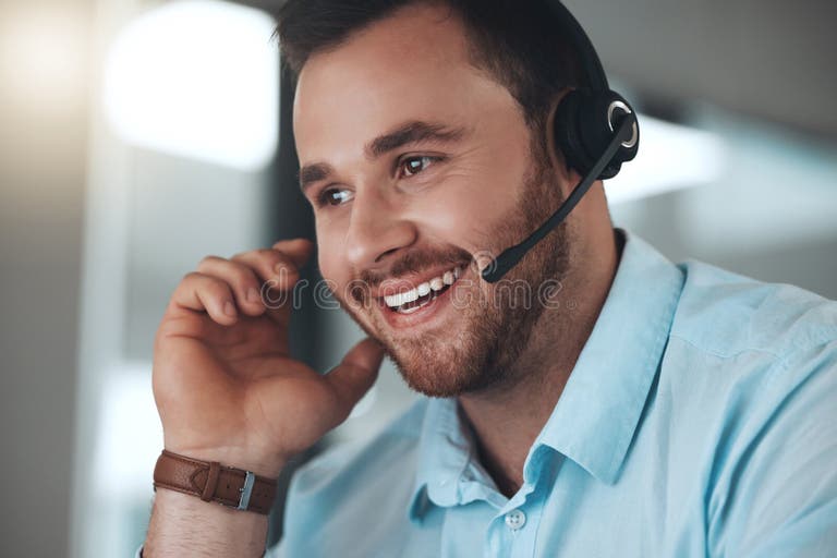 Passing Positivity Onto the Client. a Young Call Centre Agent Sitting ...