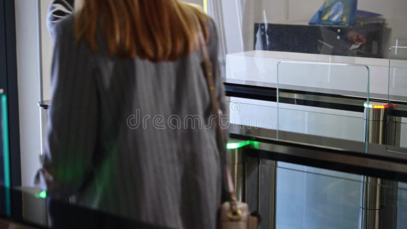 Passing through a Turnstile into an Office Building. Office Workers ...