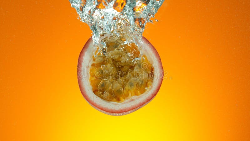 Passion Fruit Slice Falling into Water Stock Photo - Image of fruit ...