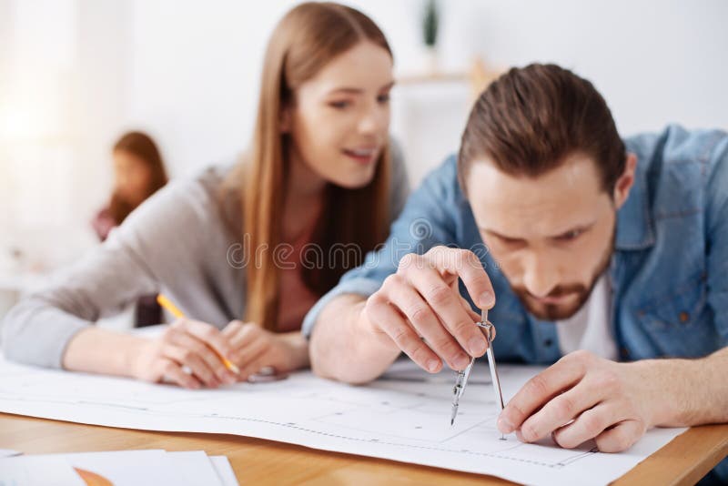 Passionate Admirable Engineer Adding New Elements Carefully Stock Photo ...