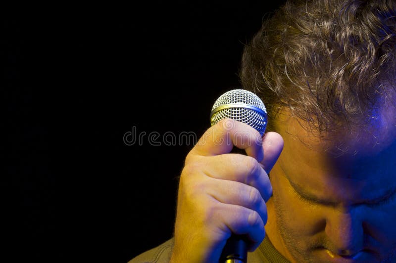 Male Heavy Metal Singer Screams into Microphone Stock Image - Image of ...