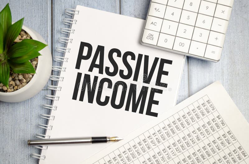 Passive Income Words on Notebook and Calculator with Charts Stock Photo ...