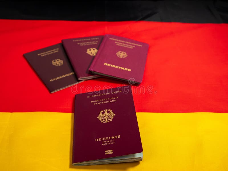 Passport of a Citizen of Germany on the Background of the Flag of ...