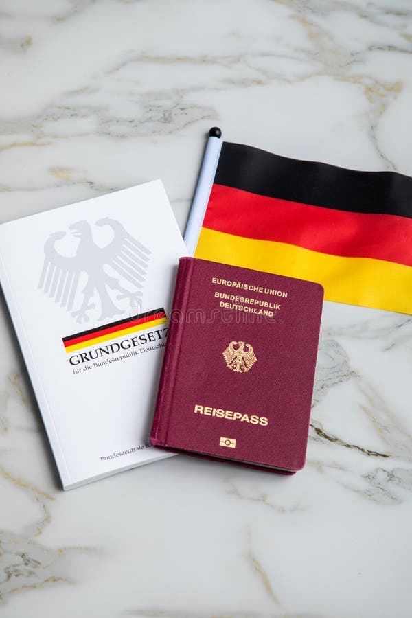 Passport and Constitution Basic Law Book of Germany on German Flag ...