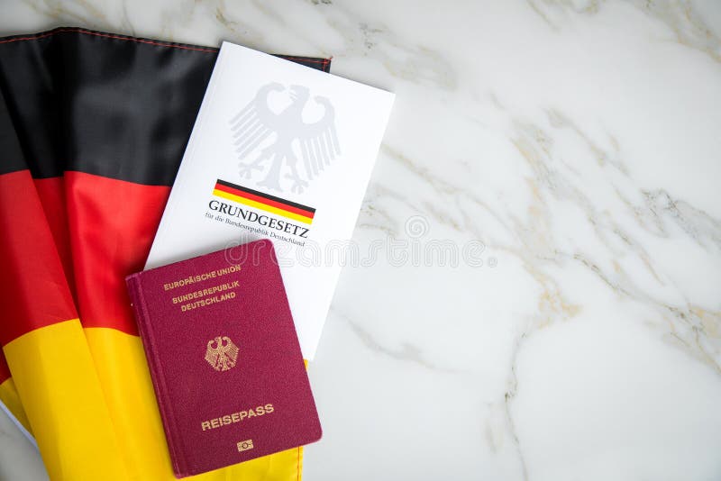 Passport and Constitution Basic Law Book of Germany on German Flag ...