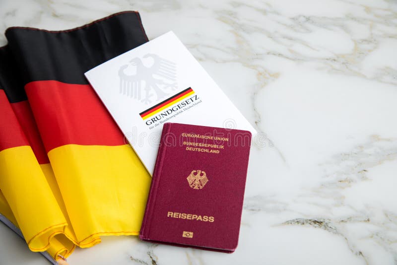 Passport and Constitution Basic Law Book of Germany on German Flag ...