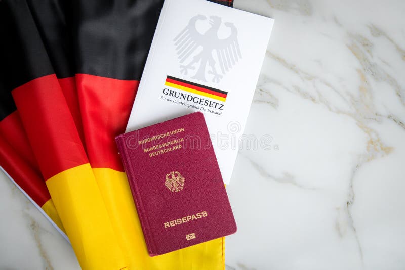 Passport and Constitution Basic Law Book of Germany on German Flag ...