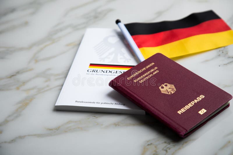 Passport and Constitution Basic Law Book of Germany on German Flag ...
