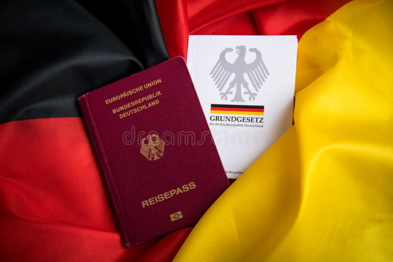 Passport and Constitution Basic Law Book of Germany on German Flag ...