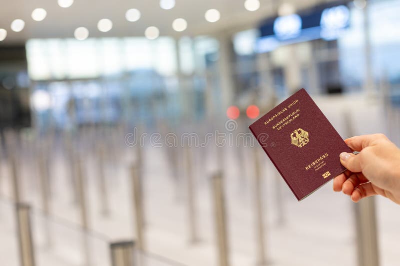 Passport Held at Airport Security during Travel Check-in Process in a ...