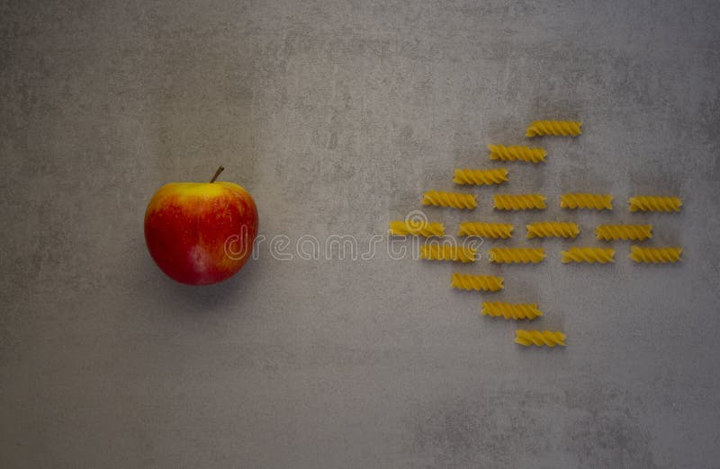 Pasta Arrow Points To an Apple on a Blue Background Stock Photo - Image ...