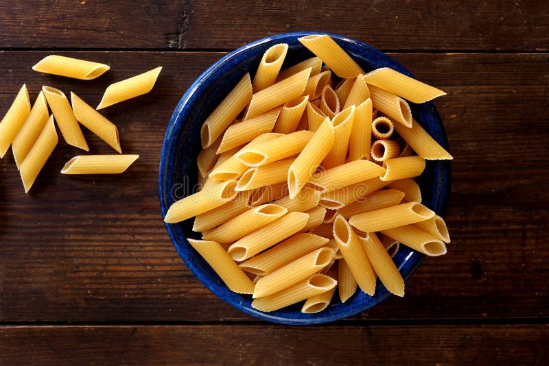 Pasta and Blue Bowl on Textured Table Stock Image - Image of dinner ...