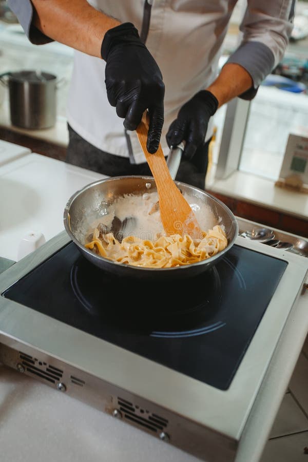 Pasta Boiling in a Pan on White Table Stock Image - Image of pasta ...