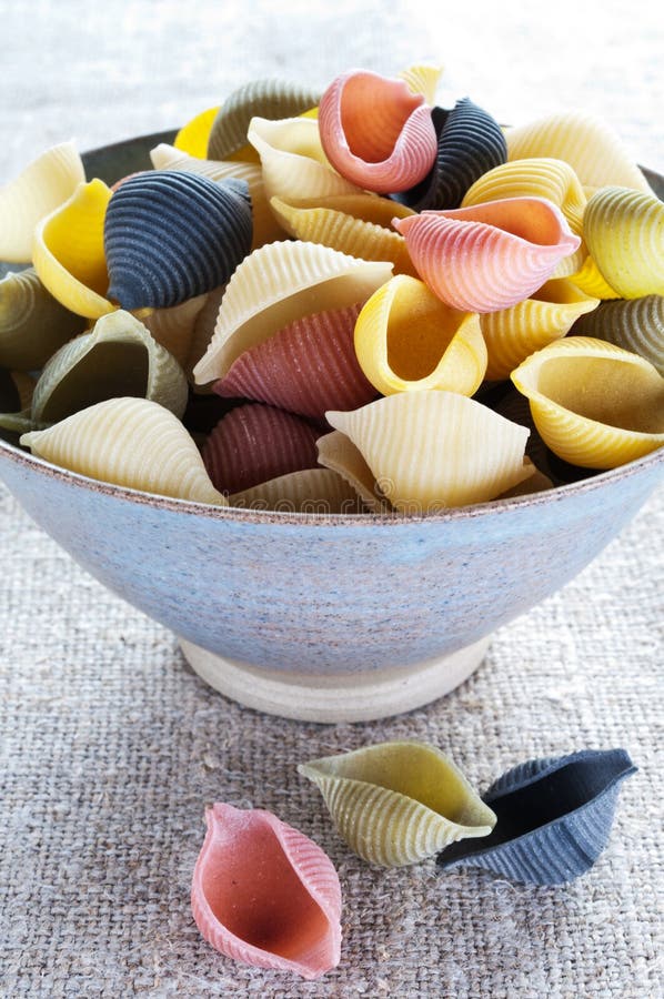 Pasta in bowl stock image. Image of tricolor, uncooked - 23460739
