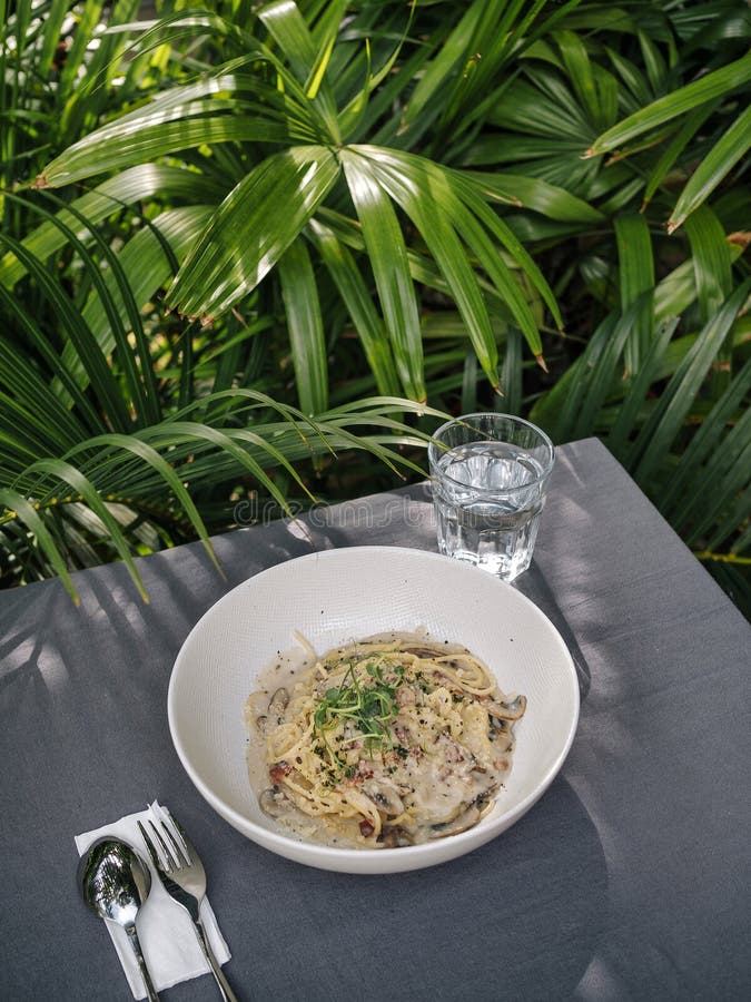 Pasta Bucatini Carbonara and Coconut on the Table. Stock Photo - Image ...
