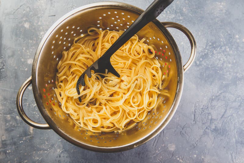 Pasta on a colander spoon stock image. Image of spoon - 28761939