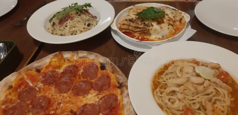 Pasta dinner party stock image. Image of meat, produce - 209470821