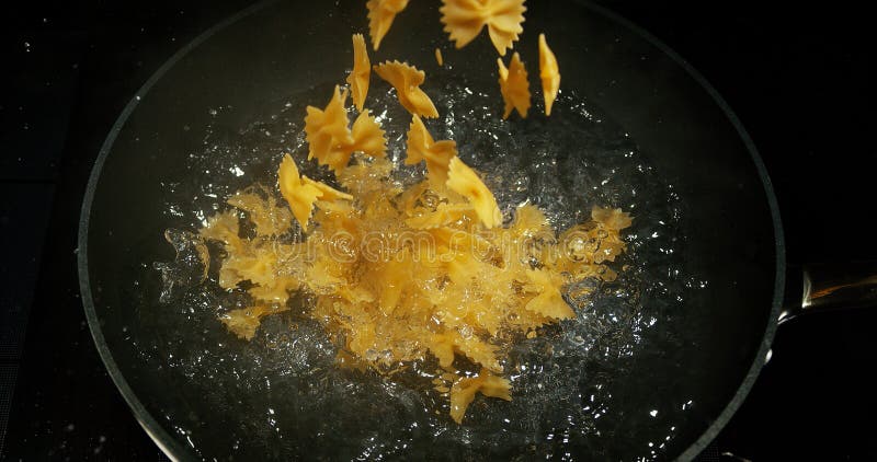 Pasta Falling into Boiling Water Stock Photo - Image of cooking ...