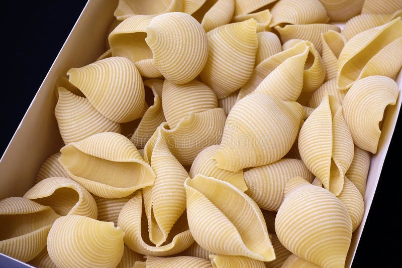 Pasta in the Form of Shells Close-up. Culinary Background Stock Image ...
