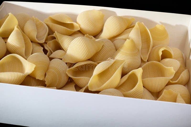 Pasta in the Form of Shells Close-up. Culinary Background Stock Image ...