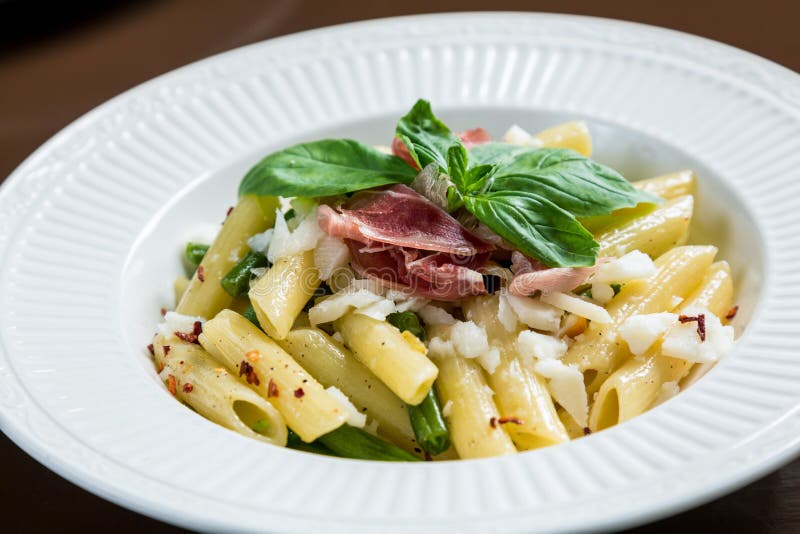 Pasta with Ham and Goat Cheese Stock Image - Image of parsley, cheese ...