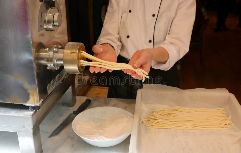 Pasta Maker during the Process of Extruding Fresh Egg Pasta and the ...