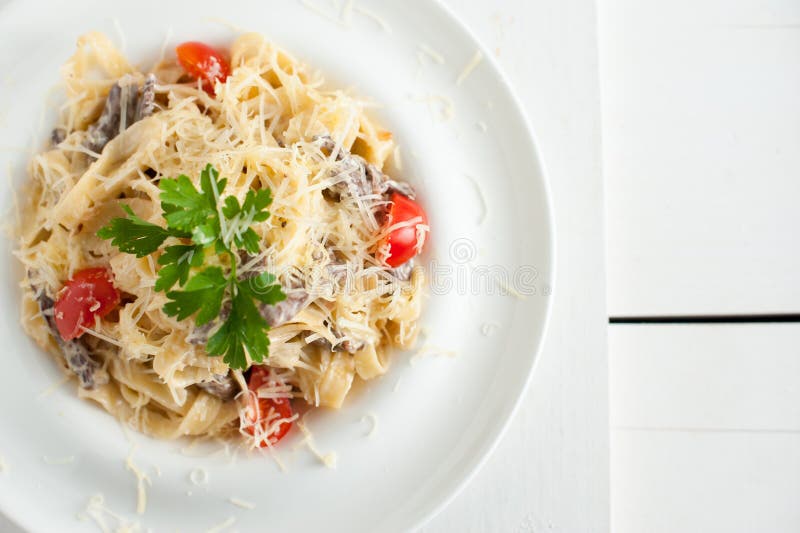 Pasta with Marbled Beef in a White Dish. Placed on a White Wooden Plank ...