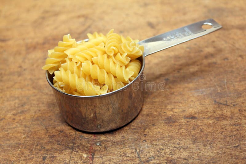 Pasta in Measuring Cup stock image. Image of wooden, liter - 24865743