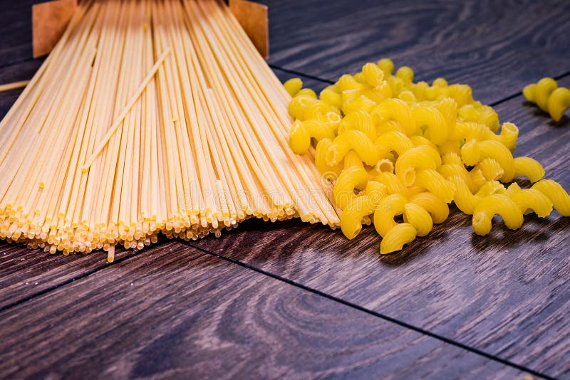 Pasta from the Pack on the Table Scattered. Stock Photo - Image of rose ...
