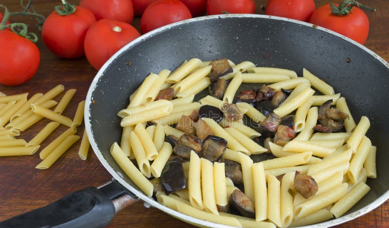Pasta in a pan stock photo. Image of pasta, wood, tomatoes - 21891232