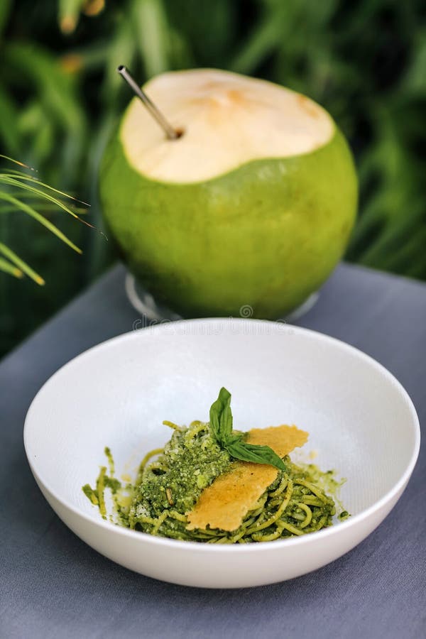 Pasta Pesto and Coconut at the Table Stock Photo - Image of plate ...