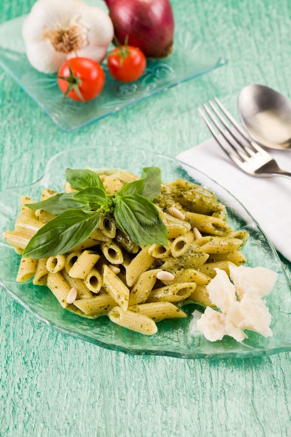 Pasta with Pesto on Green Glass Table Stock Image - Image of condiments ...