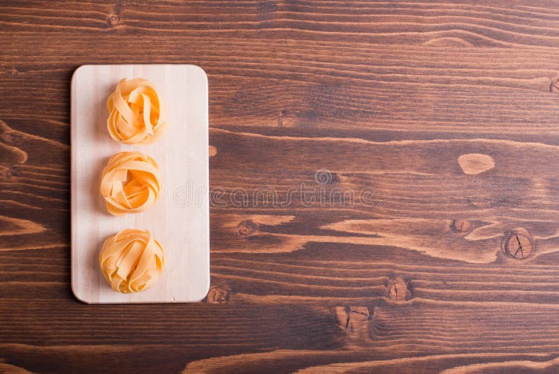 Pasta Raw Three Circles in a Row on a Small Light on a Cutting B Stock ...