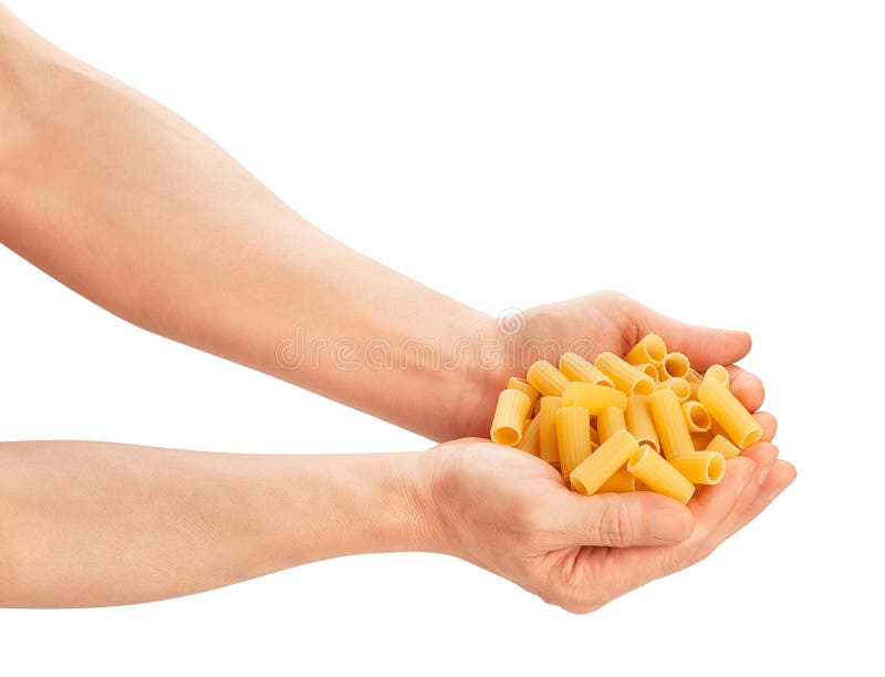 Pasta rigatoni in hand stock photo. Image of stack, side - 386925308