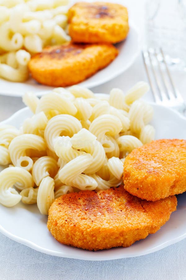 Pasta and chicken nuggets stock photo. Image of lunch - 30197074