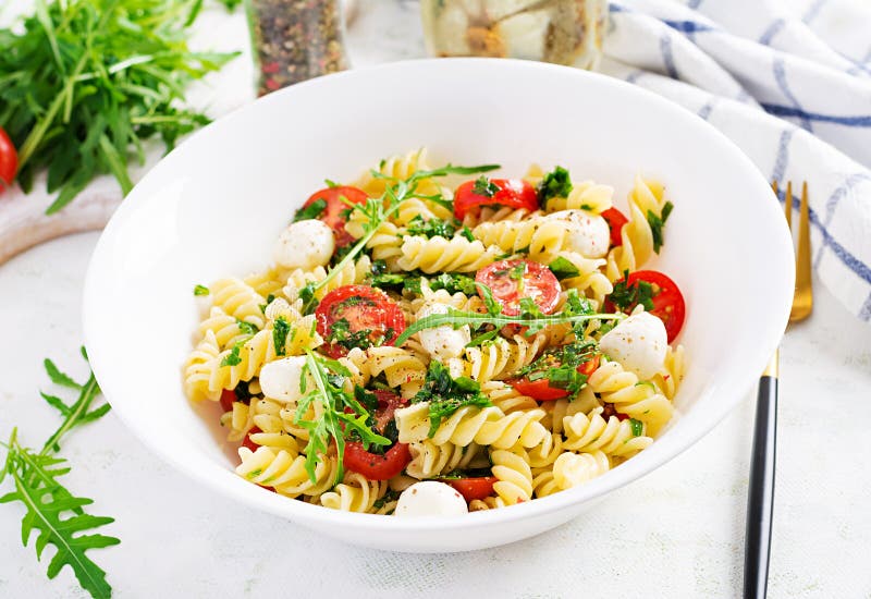 Fusilli Pasta - Caprese Salad with Tomato, Mozzarella and Basil Stock ...