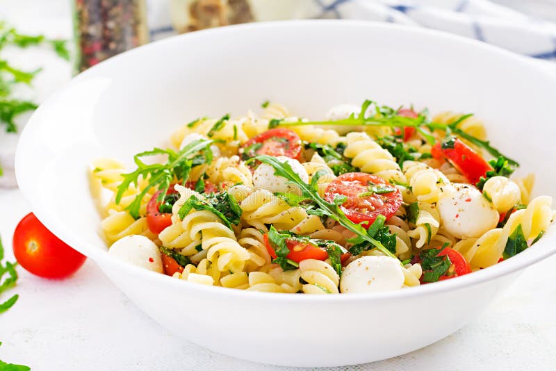 Fusilli Pasta - Caprese Salad with Tomato, Mozzarella and Basil Stock ...