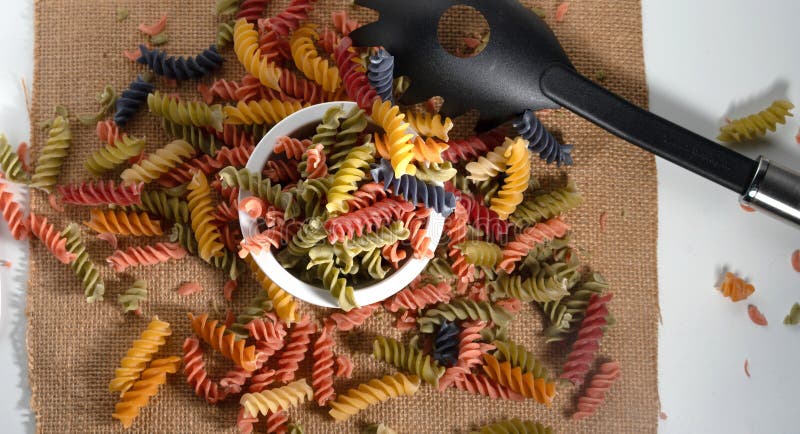 Pasta Spread on a Table Next To Utensils. Stock Image - Image of meal ...