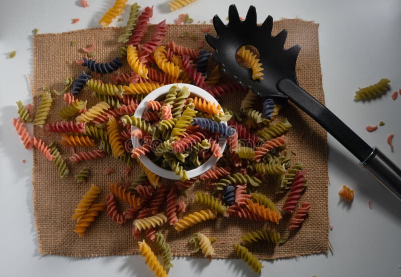 Pasta Spread on a Table Next To Utensils. Stock Image - Image of meal ...