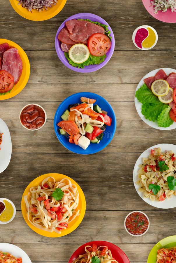Pasta with Vegetables and Sauce on a Table. Spaghetti on a Plate Stock ...