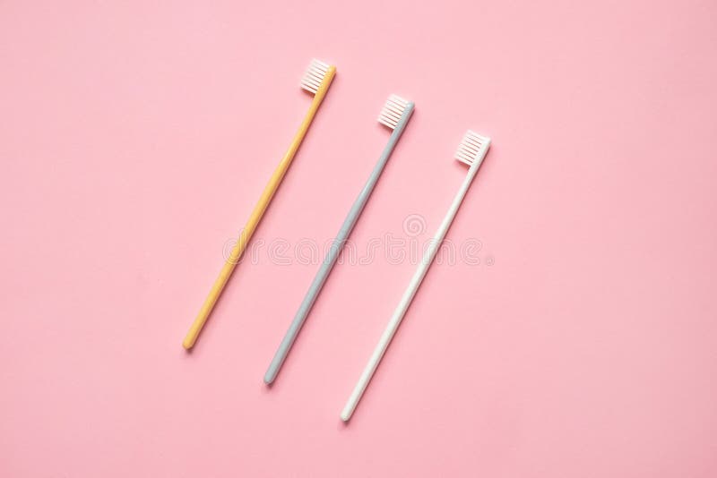 Pastel Color Toothbrushes on Pink Background .Simple Composition for ...
