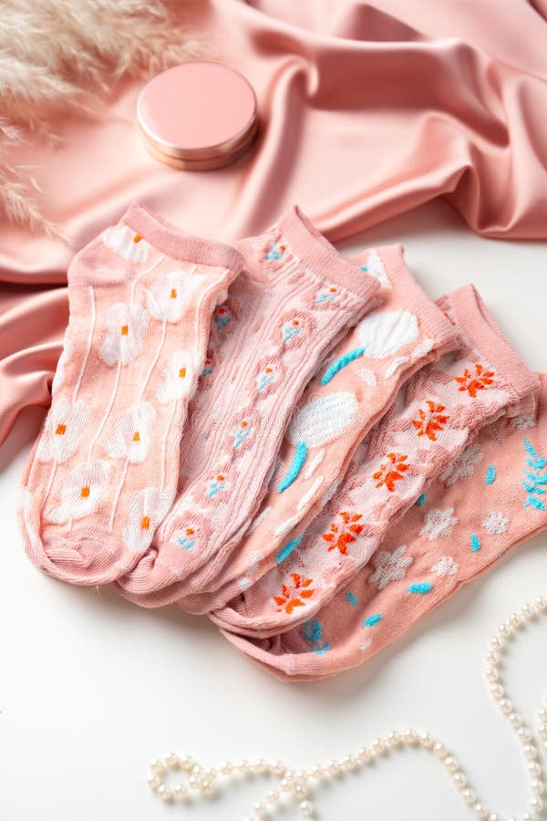 Pastel Composition with Pink Socks on White Background Stock ...