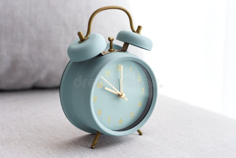 Pastel Vintage Clock on Fabric Couch Near Window Stock Image - Image of ...