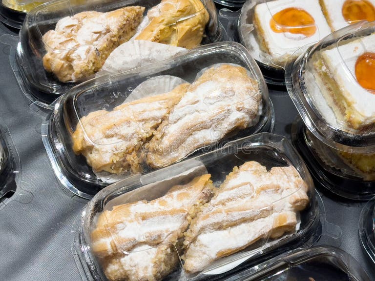 Pastries and Cakes in Clear Plastic Packaging on Display Stock Photo ...