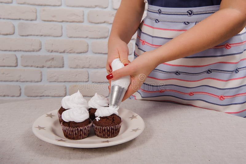 Pastry Bag Putting Cream Over Cupcake Stock Photo - Image of icing ...