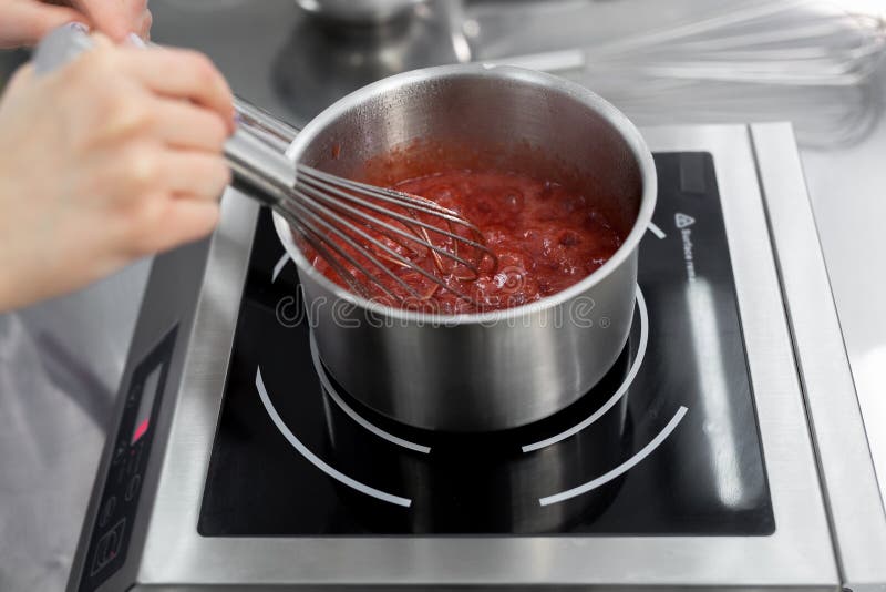 Pastry Chef Cooks Strawberry Puree with Sugar in a Saucepan Stock Image ...